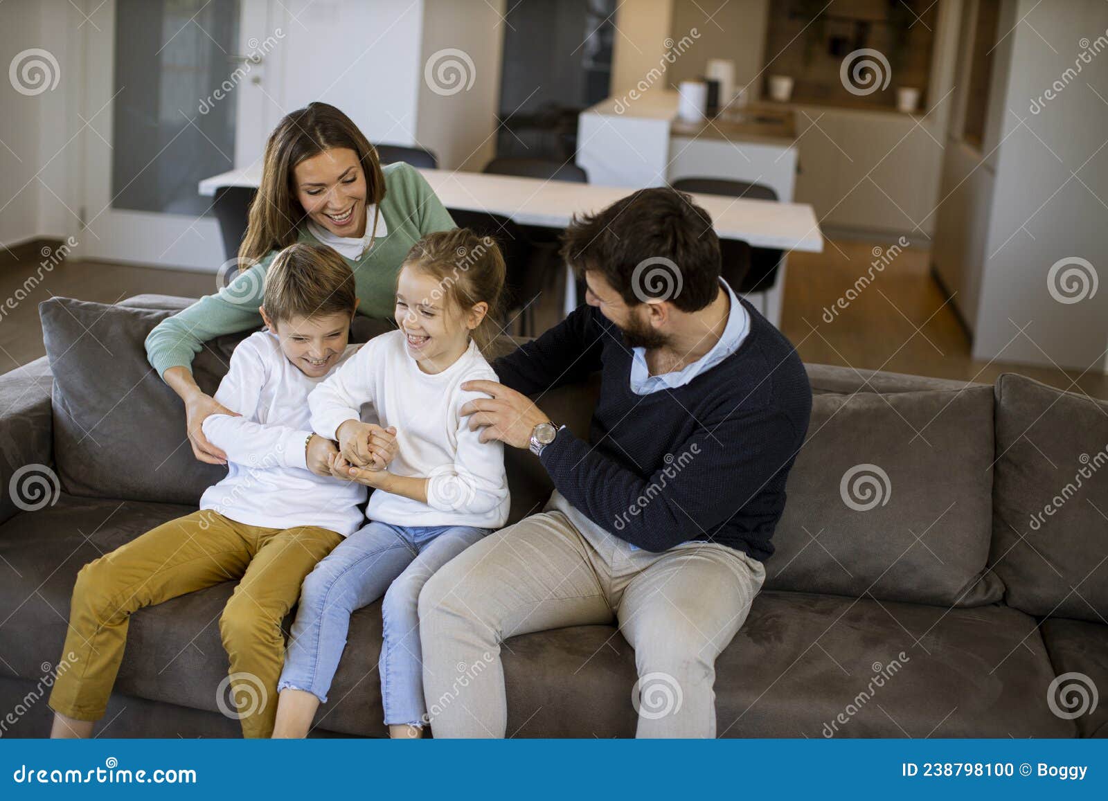 Siblings Fighting Over TV Remote Control at Home Stock Photo - Image of ...