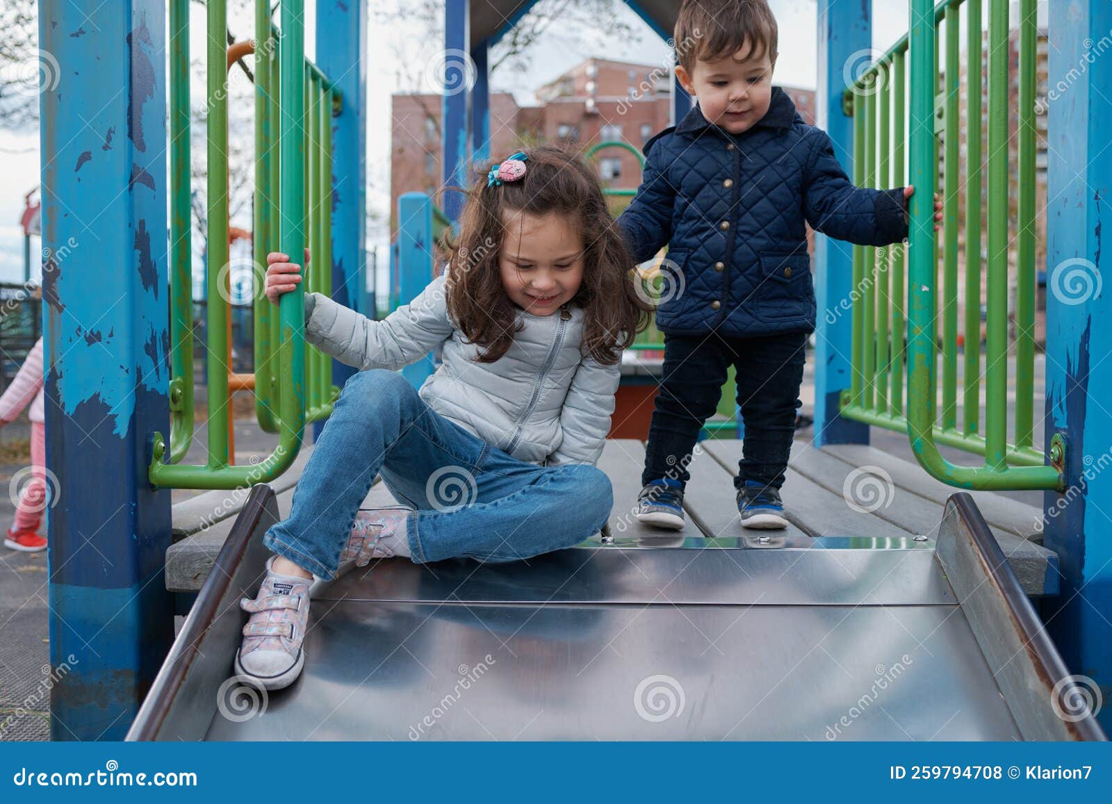 Siblings Have Fun at the Playground in the Fall Stock Photo - Image of ...
