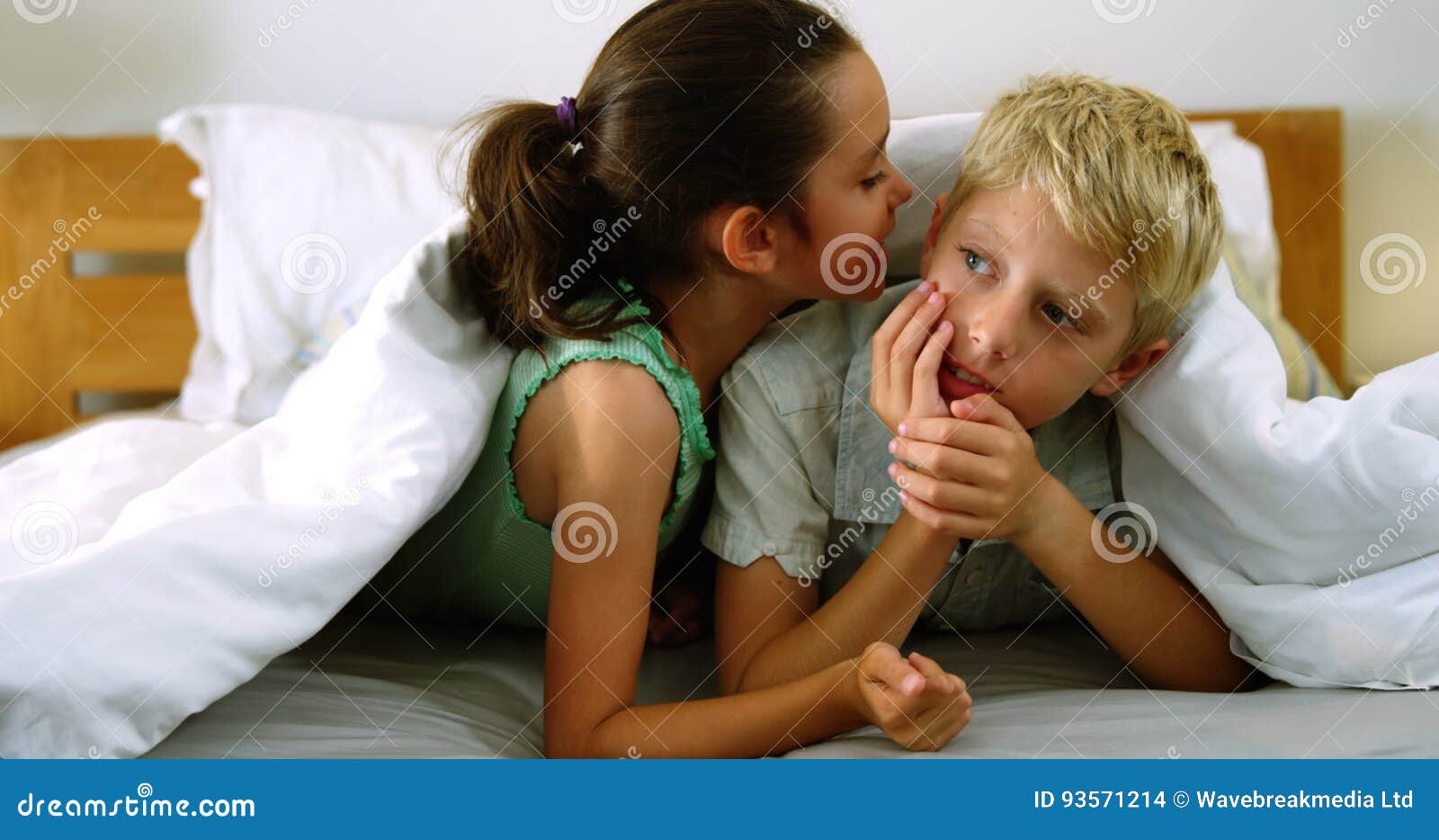 Siblings Interacting with Each Other on Bed in Bedroom Stock Footage ...