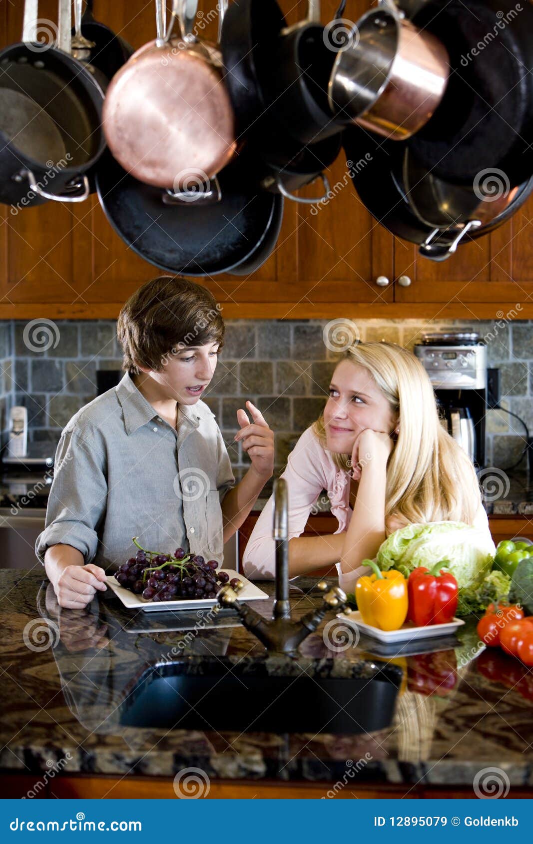 Siblings in Kitchen Chatting Stock Image - Image of teenagers, teens ...