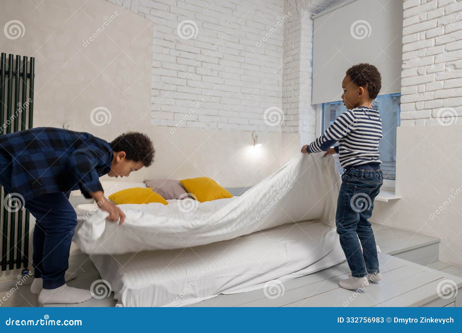 Siblings Making Bed Together and Fixing a Flock Bed Stock Image - Image ...