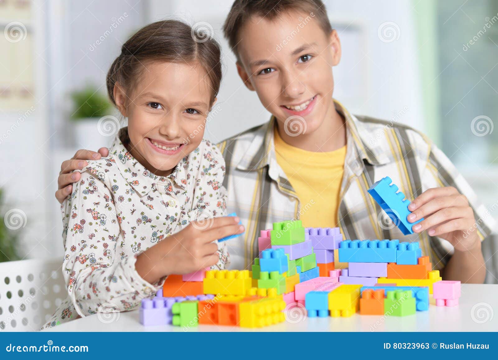 Siblings playing lego stock image. Image of small, home - 80323963