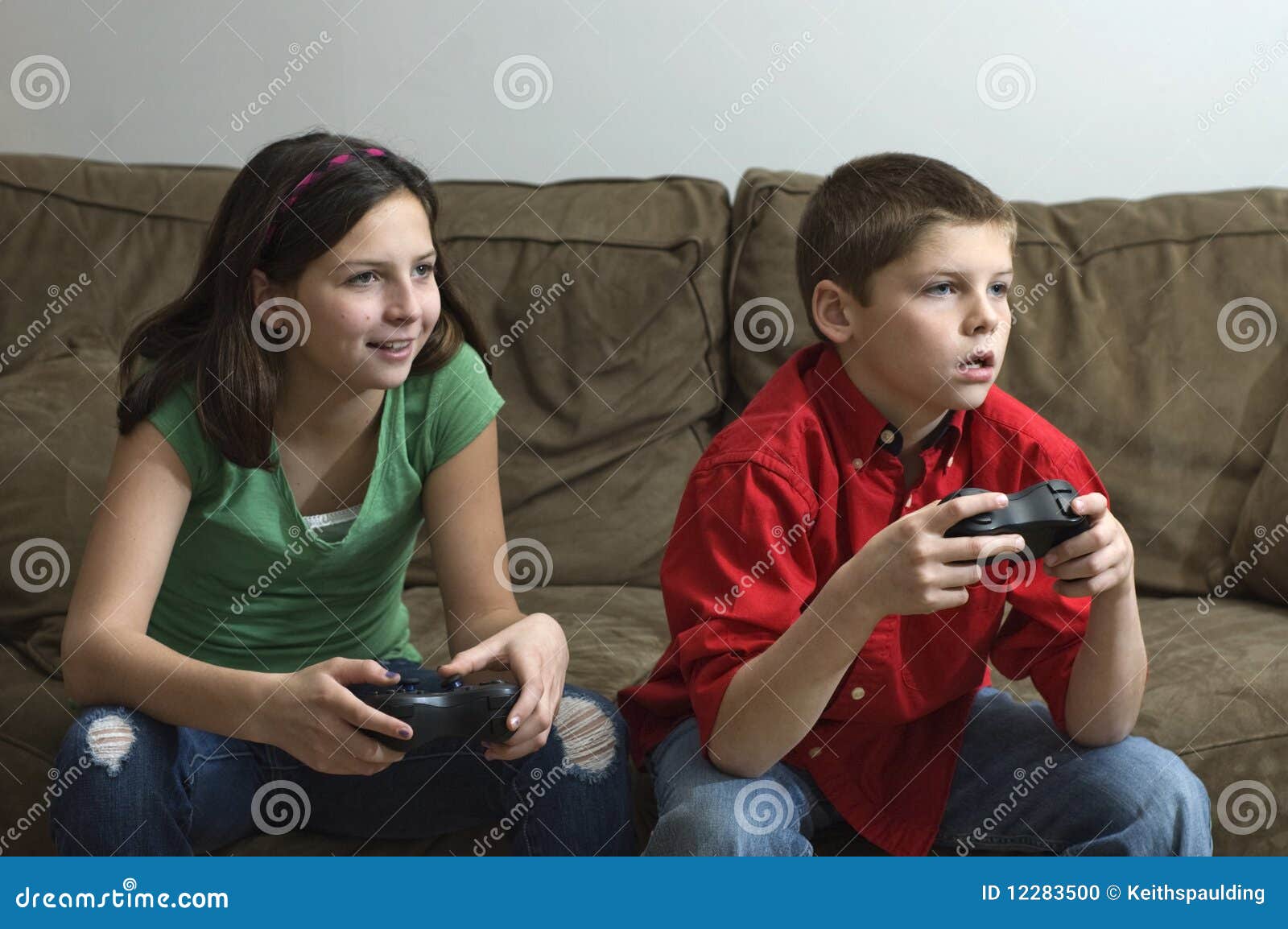 Siblings Playing a Video Game Stock Photo - Image of playful, family ...