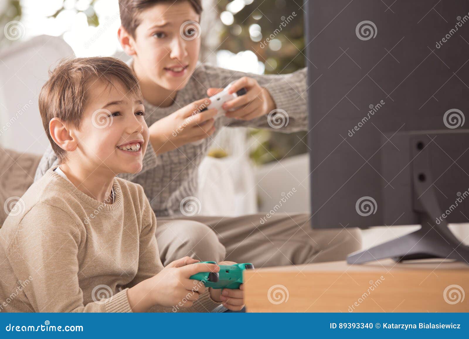 Siblings Playing Video Games Stock Photo - Image of older, emotions ...