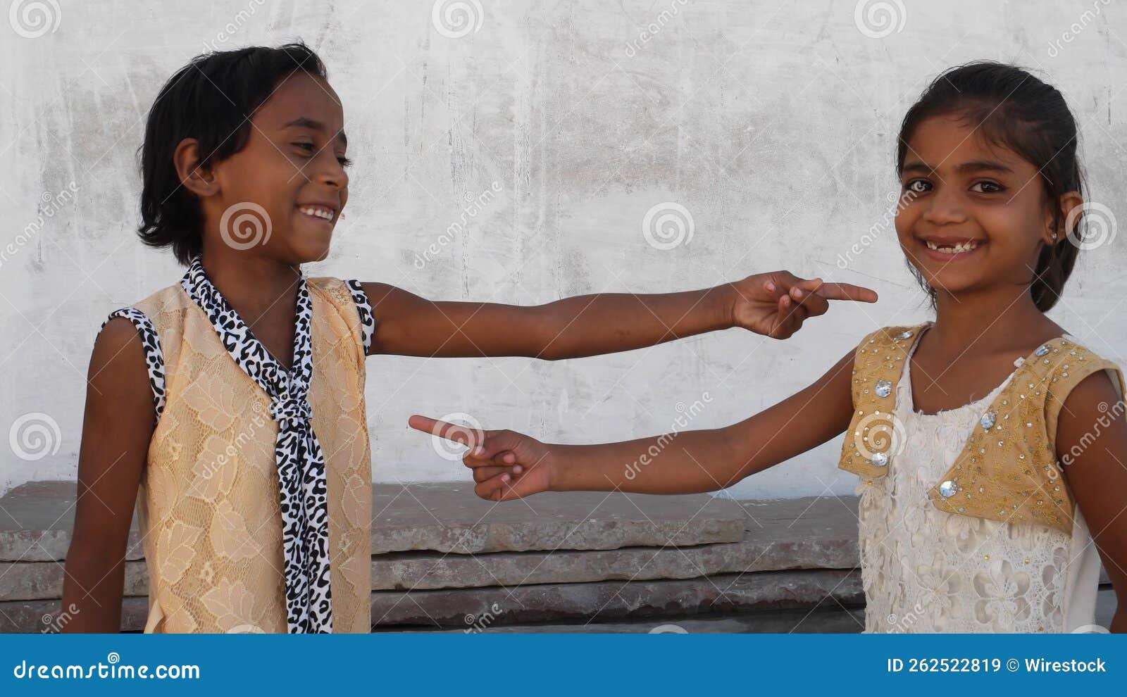 Siblings Pointing To Each Other and Smiling Stock Image - Image of girl ...