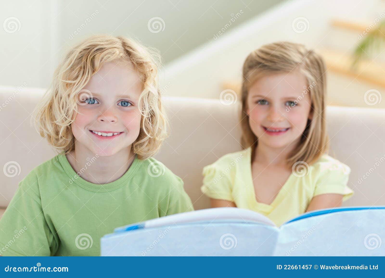 Siblings Reading Booklet on the Sofa Stock Image - Image of sister ...