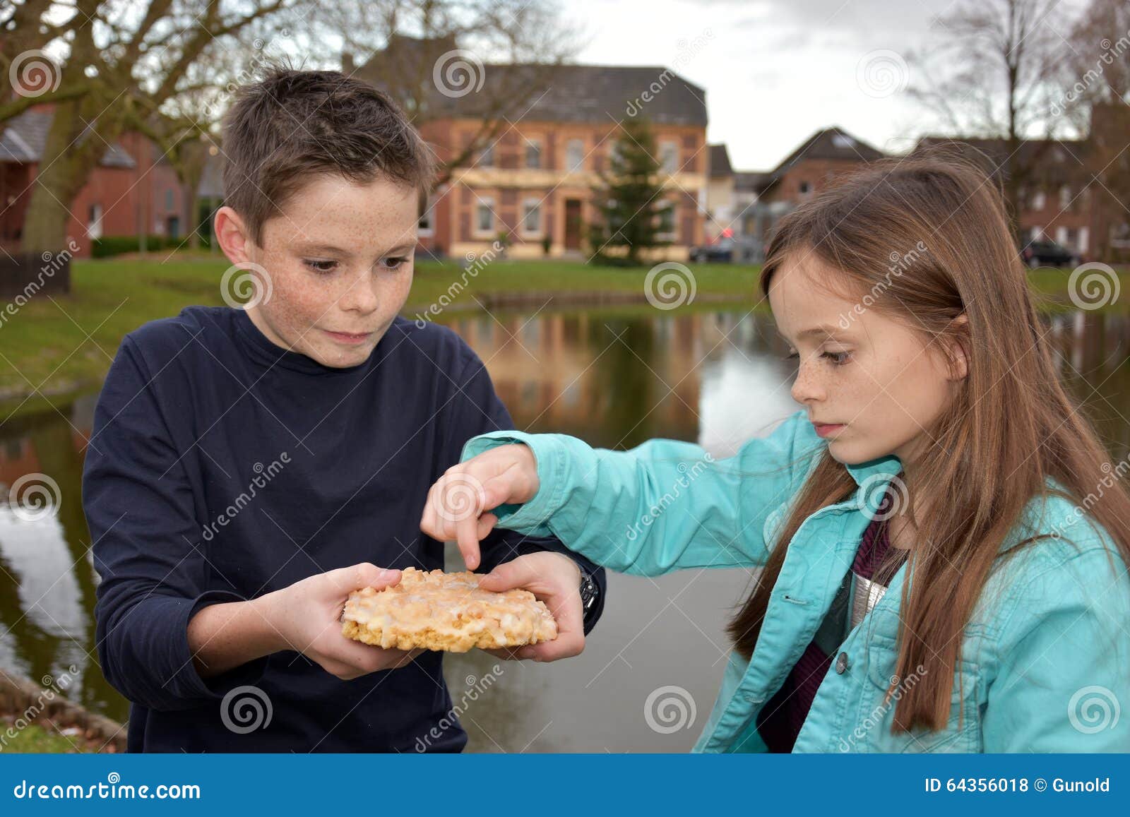 Siblings sharing pastry stock photo. Image of cake, boys - 64356018