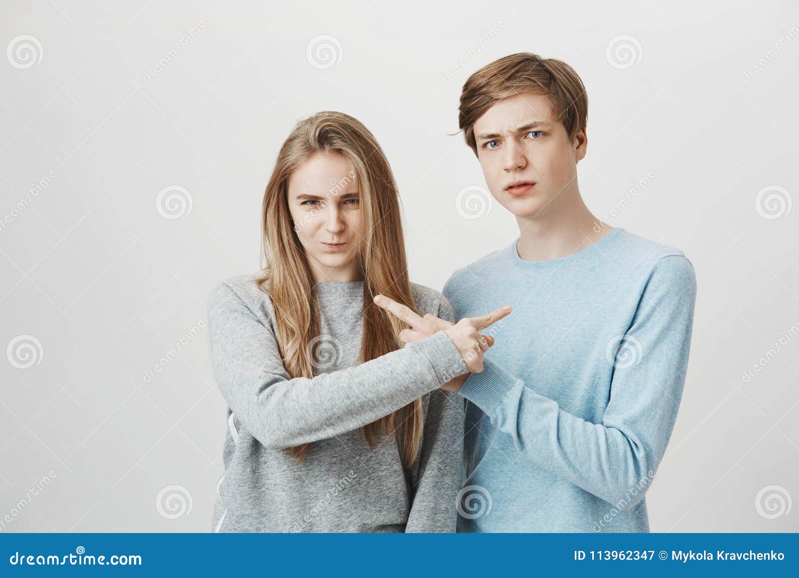 Angry Siblings Sitting Arms Crossed With Sad Mother On Sofa Royalty