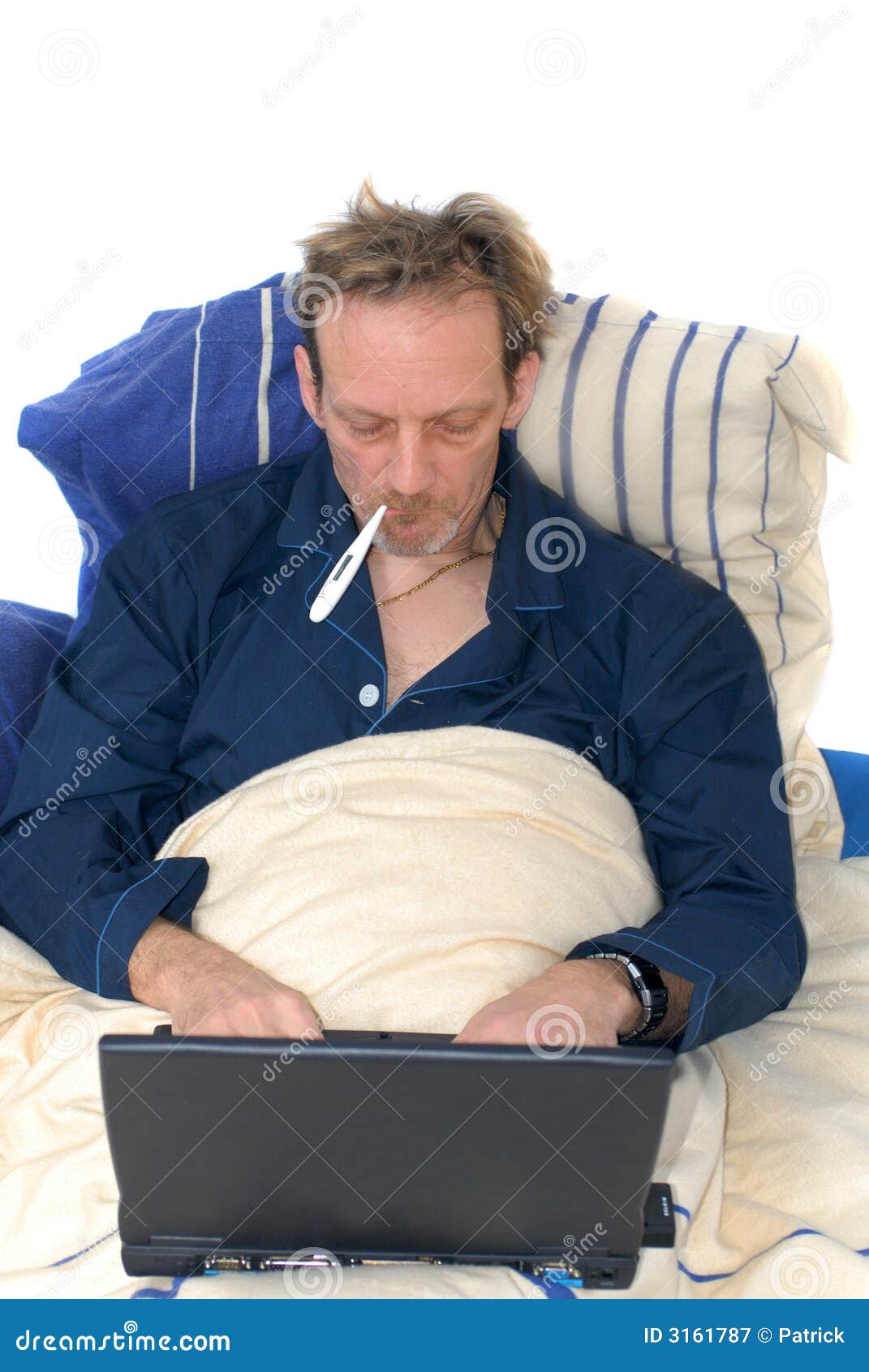 Sick in bed with laptop. stock image. Image of pillow - 3161787