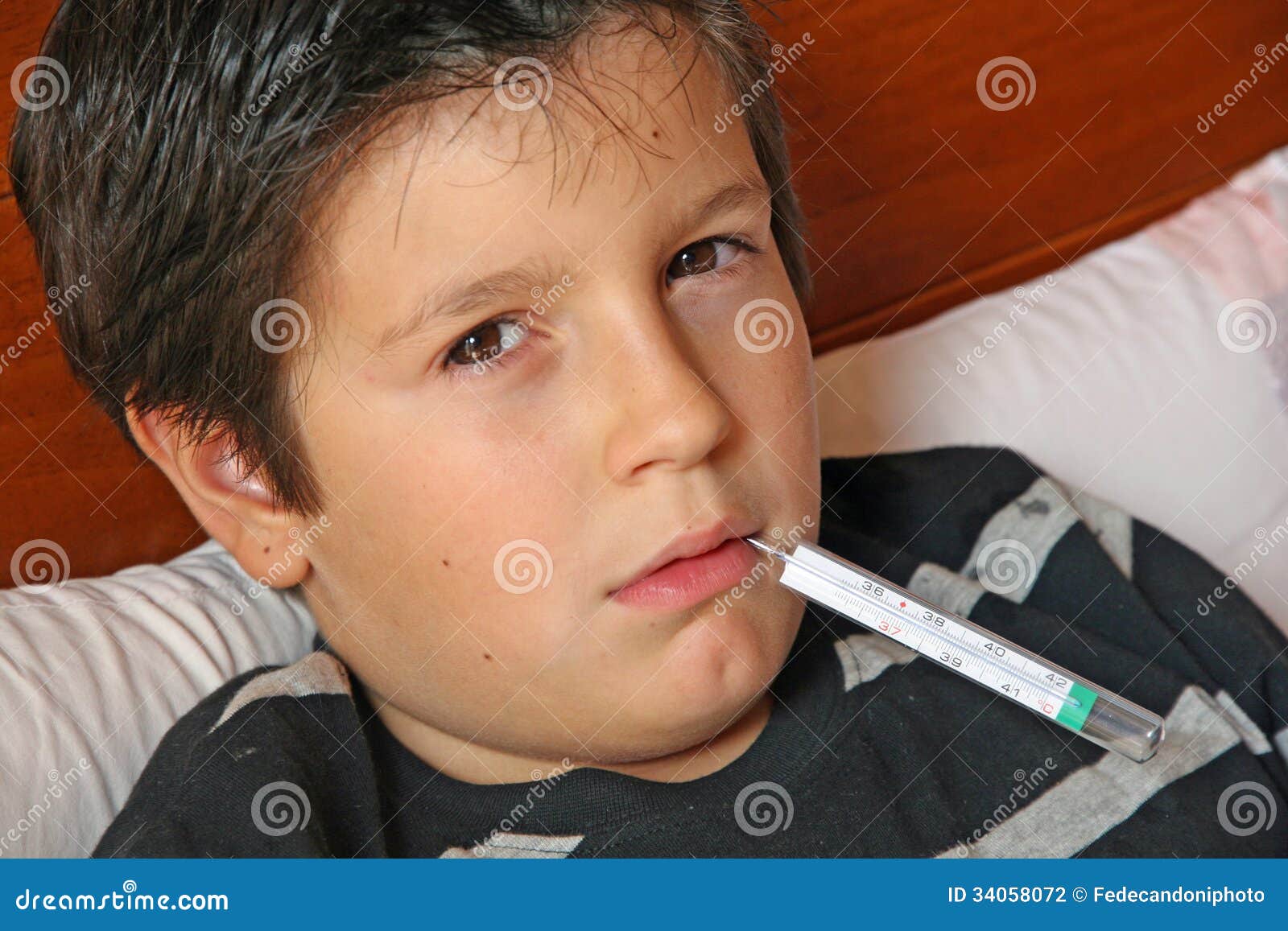 Sick Child with a Fever and Thermometer Stock Photo - Image of ...