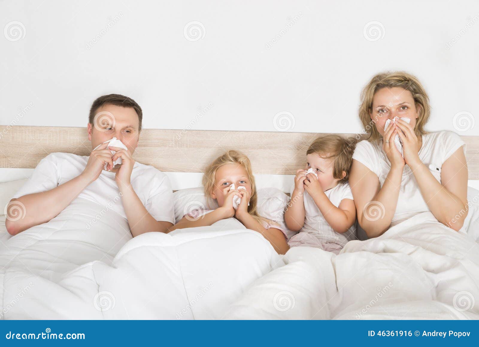 Sick family lying in bed stock photo. Image of parent - 46361916