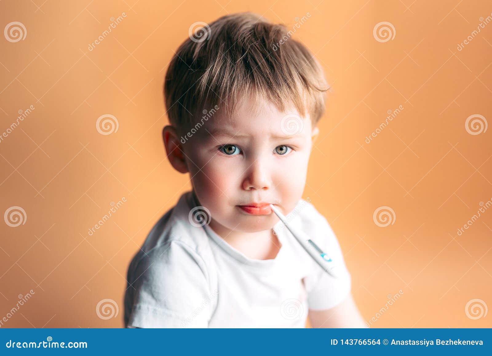 Sick Kid with a Thermometer in His Mouth with Sad Face on Orange ...
