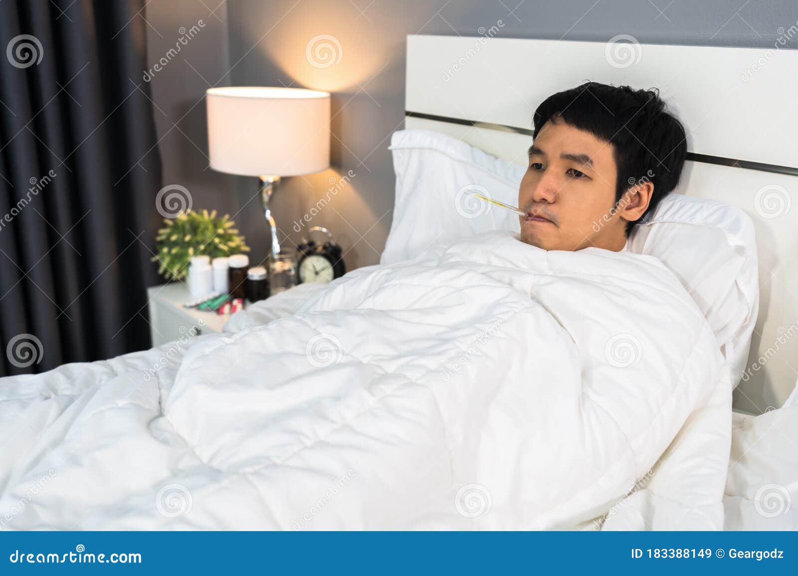 Sick Man Feeling Cold and Using Thermometer To Checking His Temperature ...