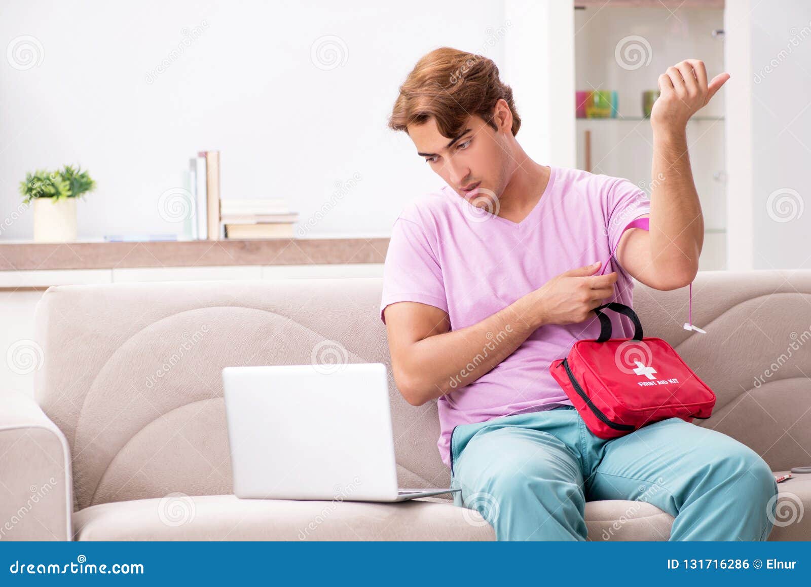 The Sick Man at Home with First Aid Kit Stock Photo - Image of couch, emergency: 131716286