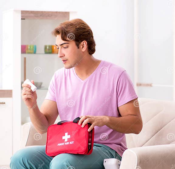 Sick Man at Home with First Aid Kit Stock Image - Image of emergency, care: 181913359