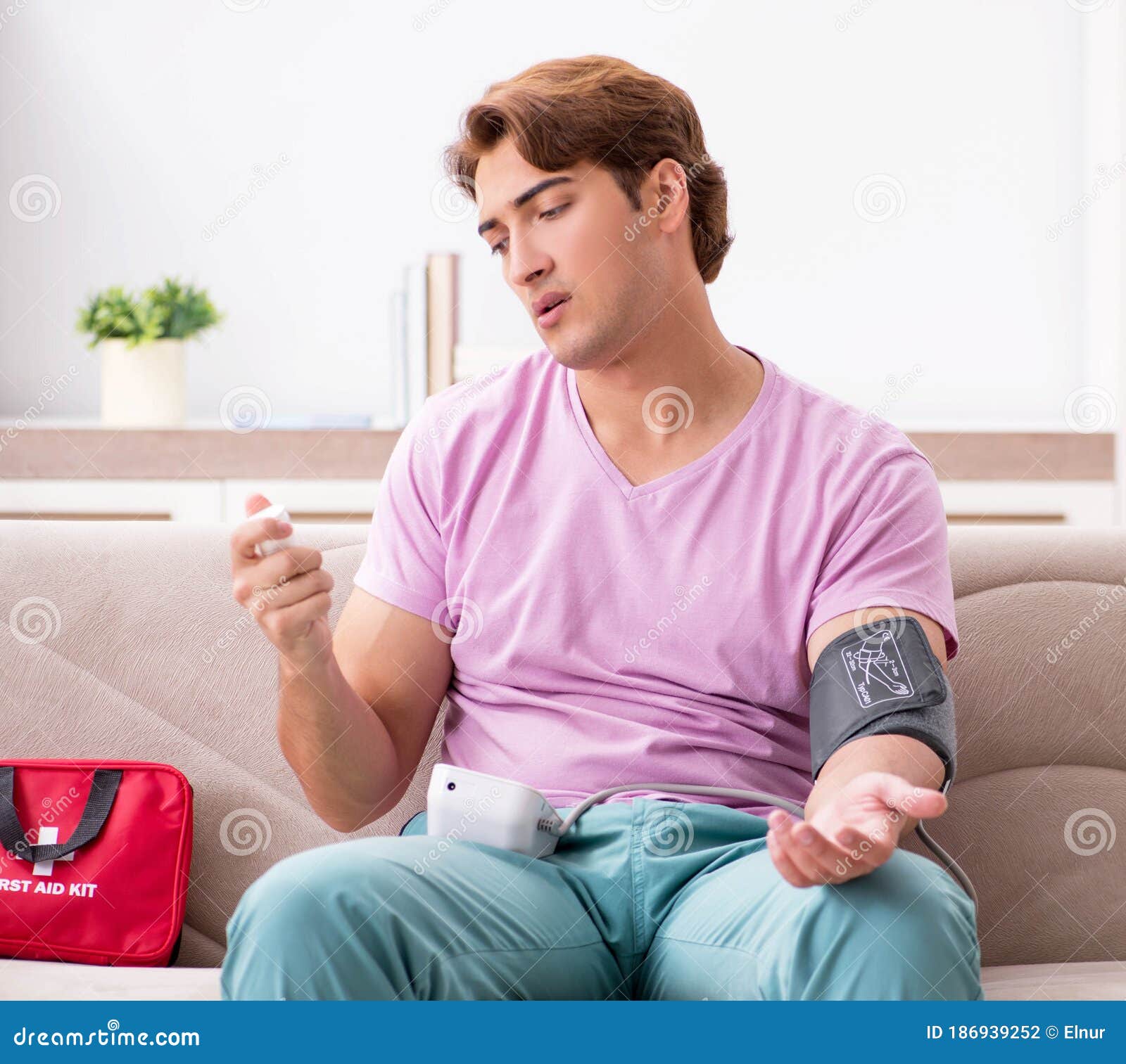 Sick Man at Home with First Aid Kit Stock Photo - Image of care, injury: 186939252