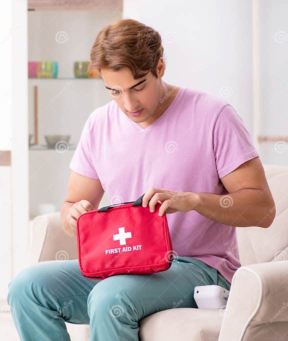Sick Man at Home with First Aid Kit Stock Photo - Image of assistance, medicine: 289515840