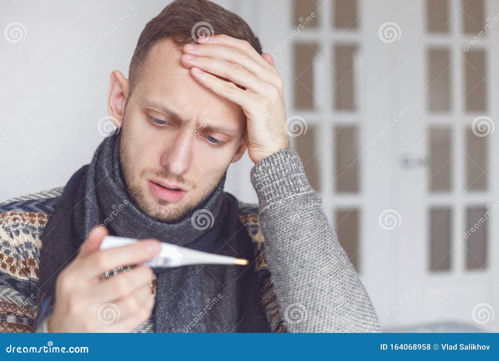 Sick Man Learn about His High Temperature at Home in the Living Room ...