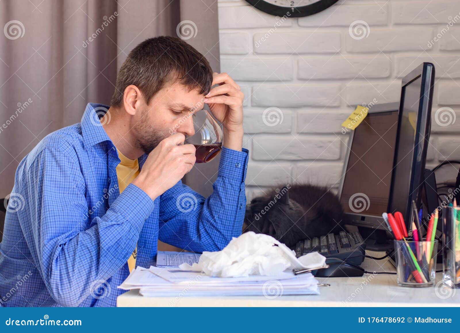 A Sick Man Sits at a Computer and Drinks Tea Stock Photo - Image of ...