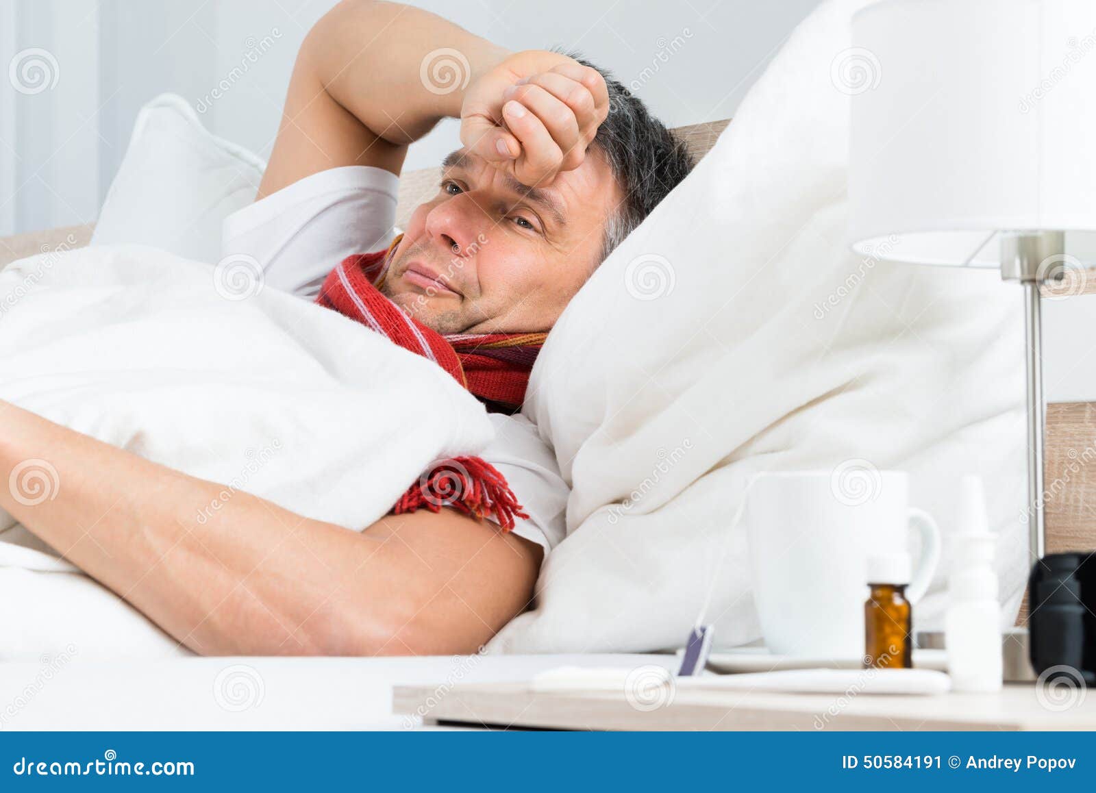 Sick mature man on bed stock image. Image of bedding - 50584191