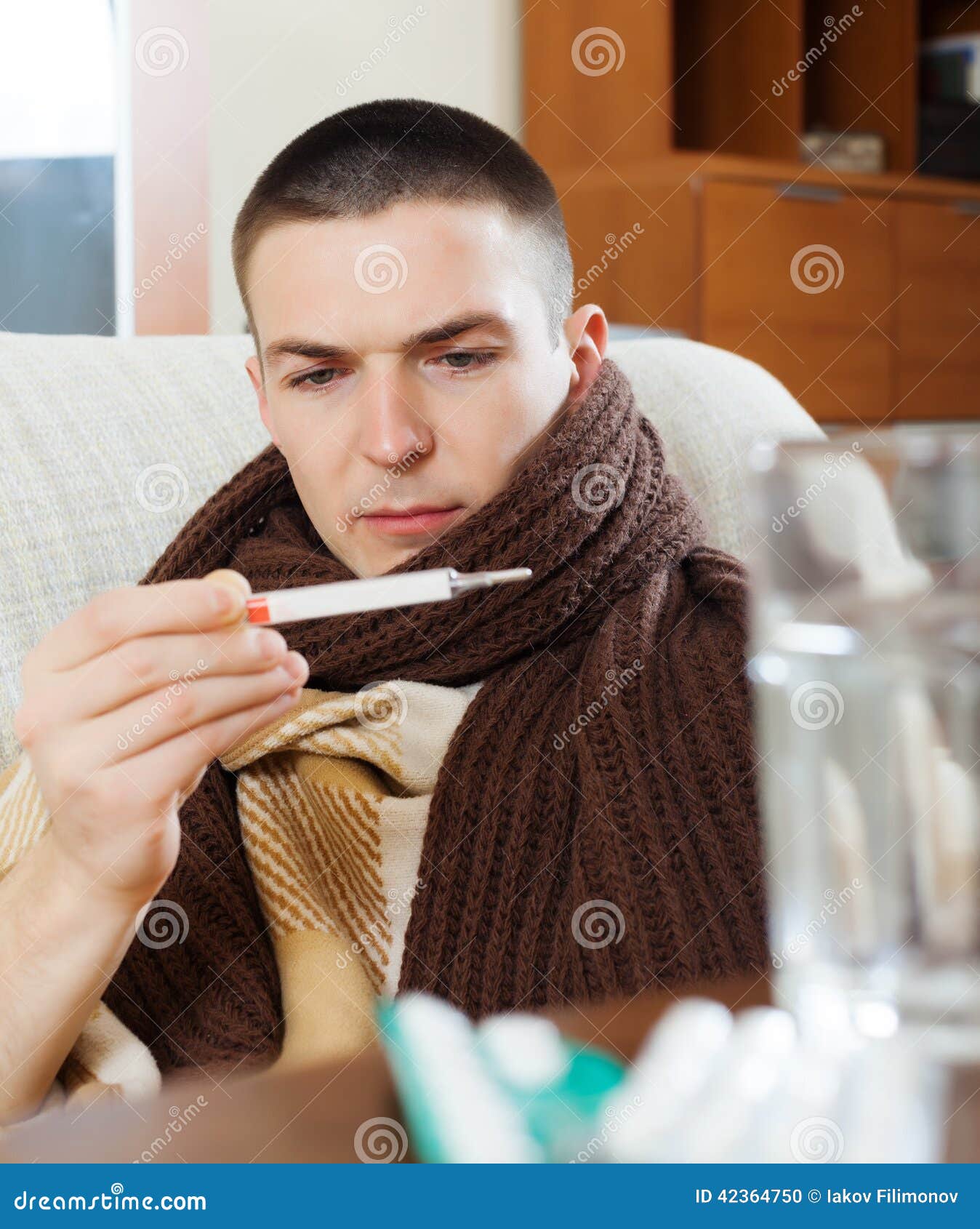 Sick Ordinary Man Looking by Thermometer Stock Photo - Image of ...
