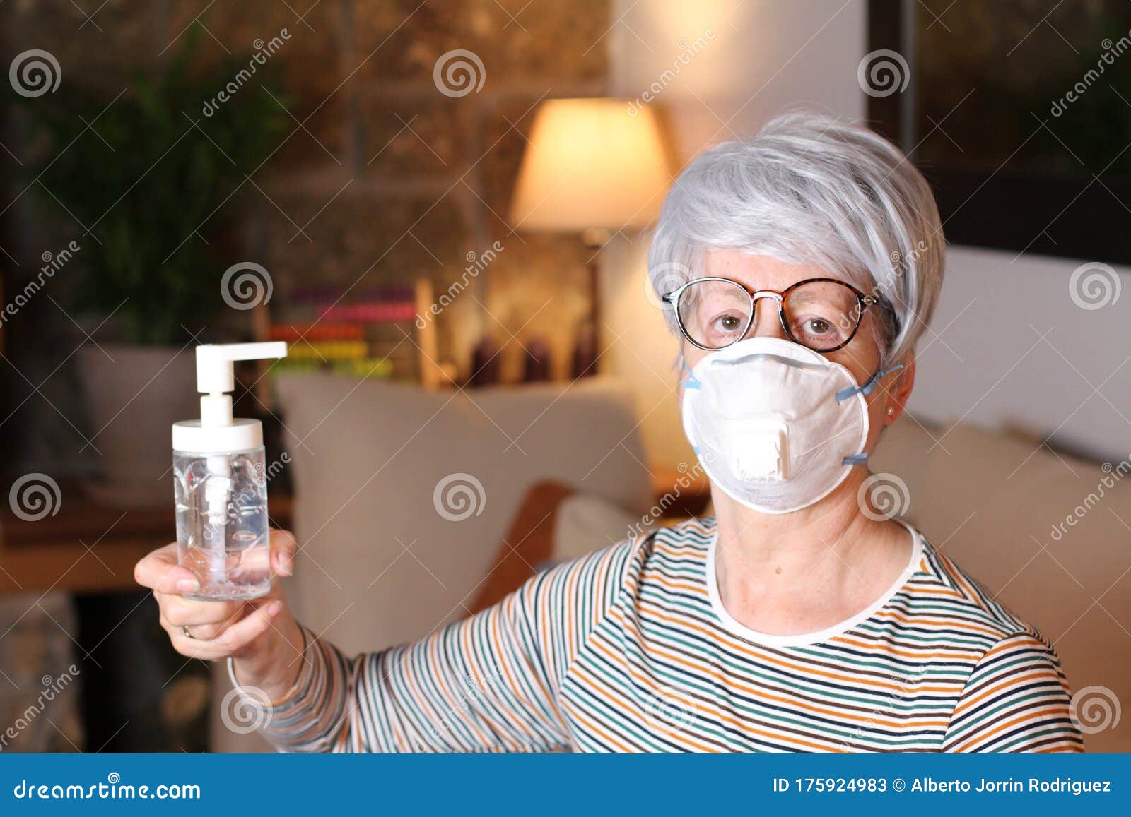 Sick Senior Woman Using Hand Sanitizer at Home Stock Image - Image of ...