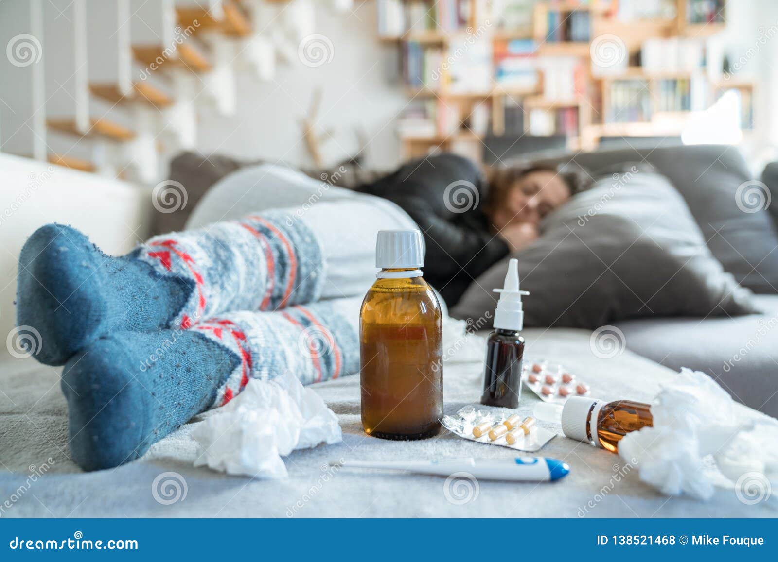 Sick Woman With Flu Cold Fever Or Virus Sitting On Sofa At Home Stock