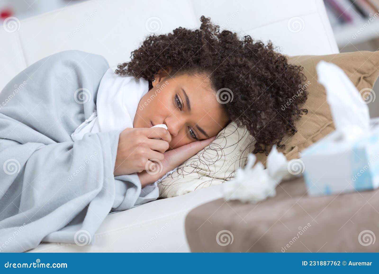 Sick woman on sofa stock photo. Image of illness, season - 231887762