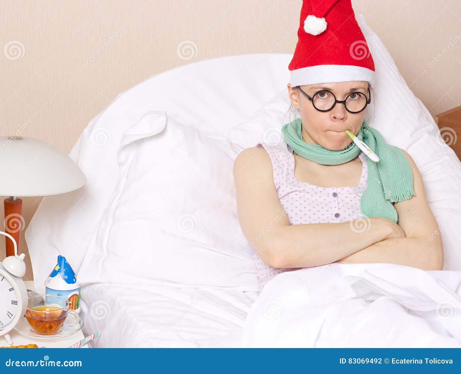Sick young lady in her bed stock photo. Image of surprise - 83069492