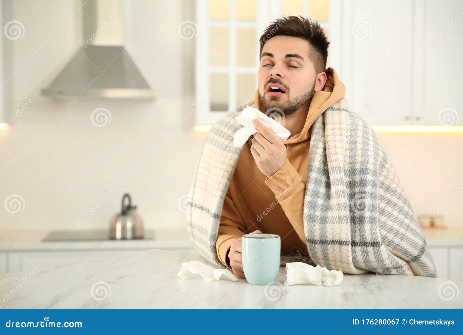 Sick Young Man with Cup of Hot Drink and Tissues. Influenza Virus Stock ...