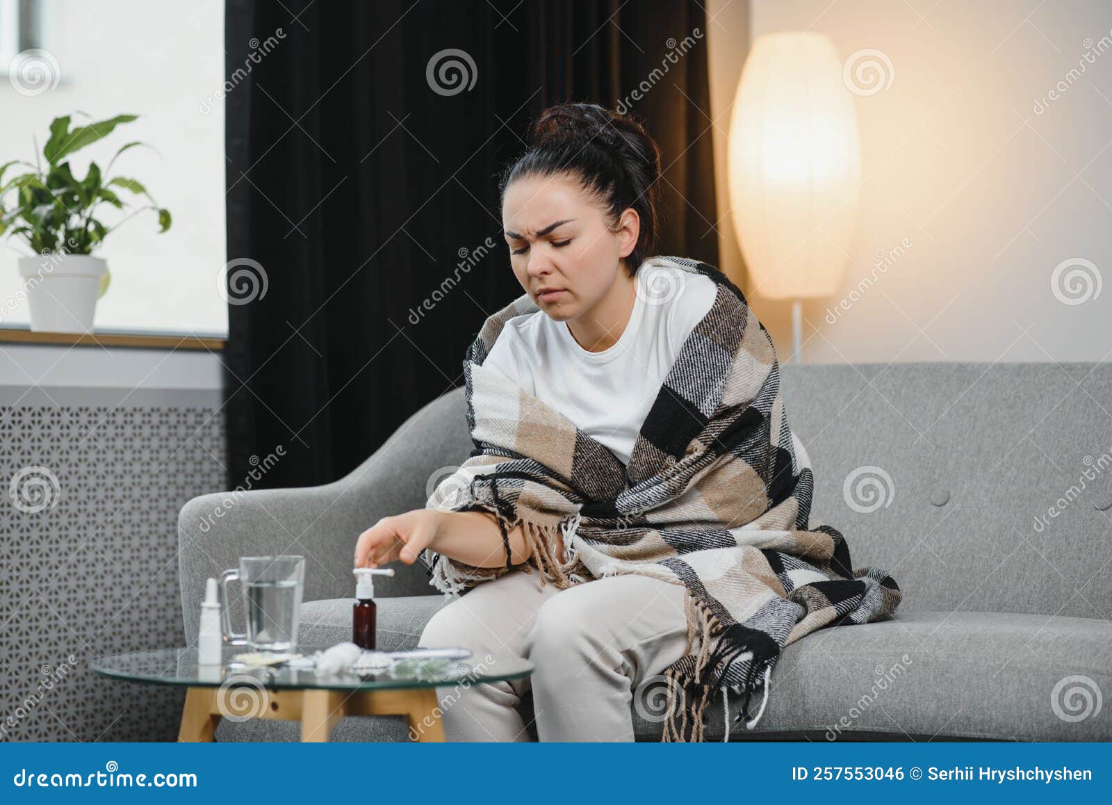 Sick Young Woman in Scarf Using Cough Spray. Stock Photo - Image of ...