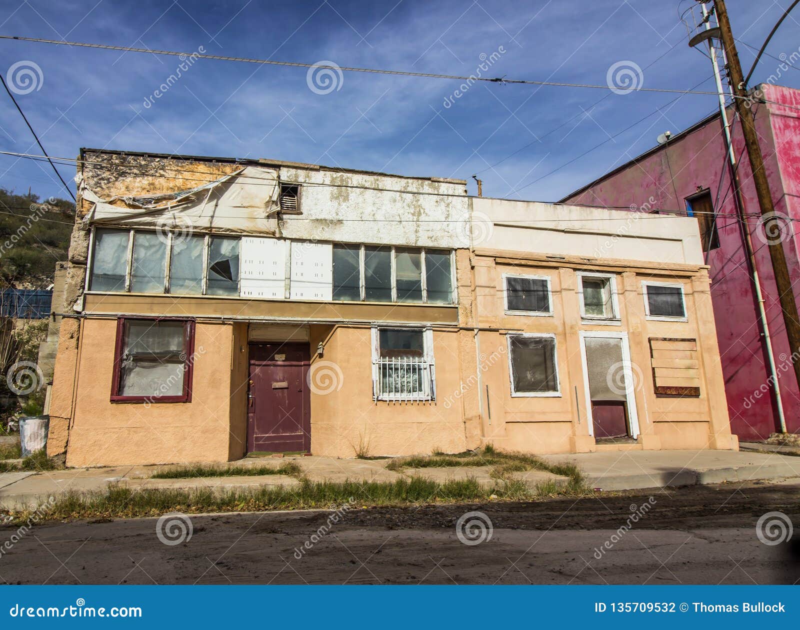 Side by Side Boarded Up Distressed Buildings in Need of Repair Stock ...