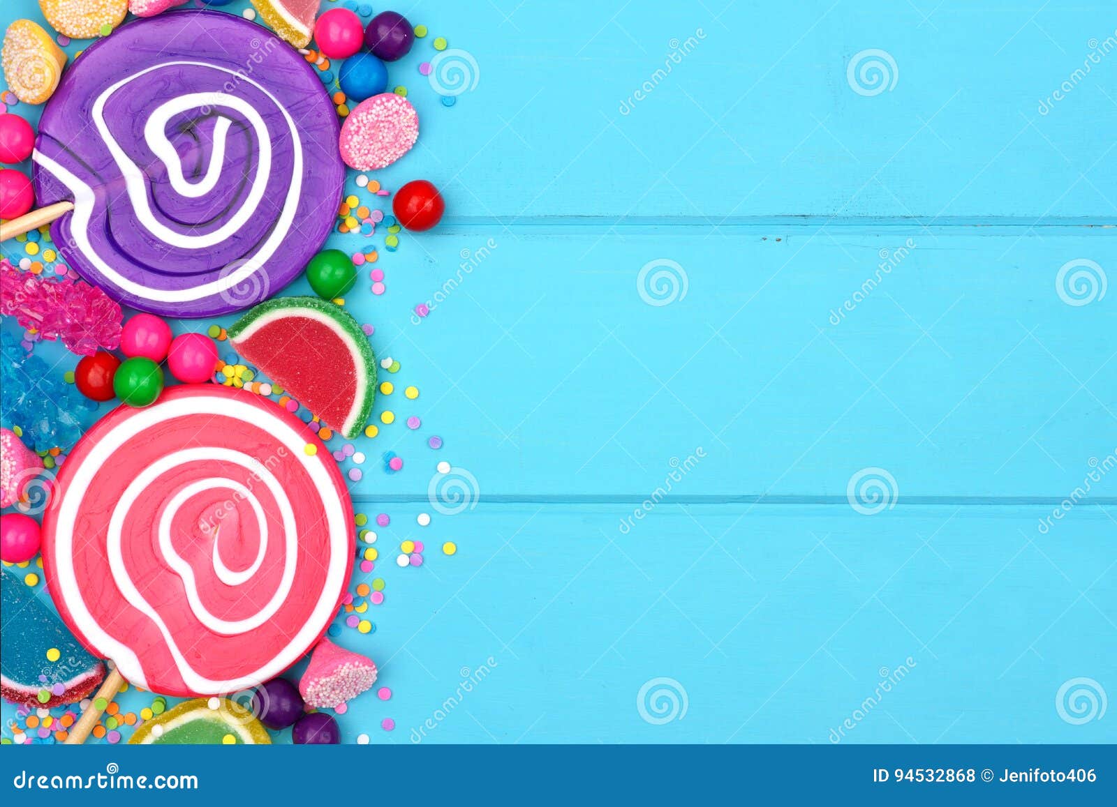 Side Border of Colorful Assorted Candies Against Blue Wood Stock Photo ...