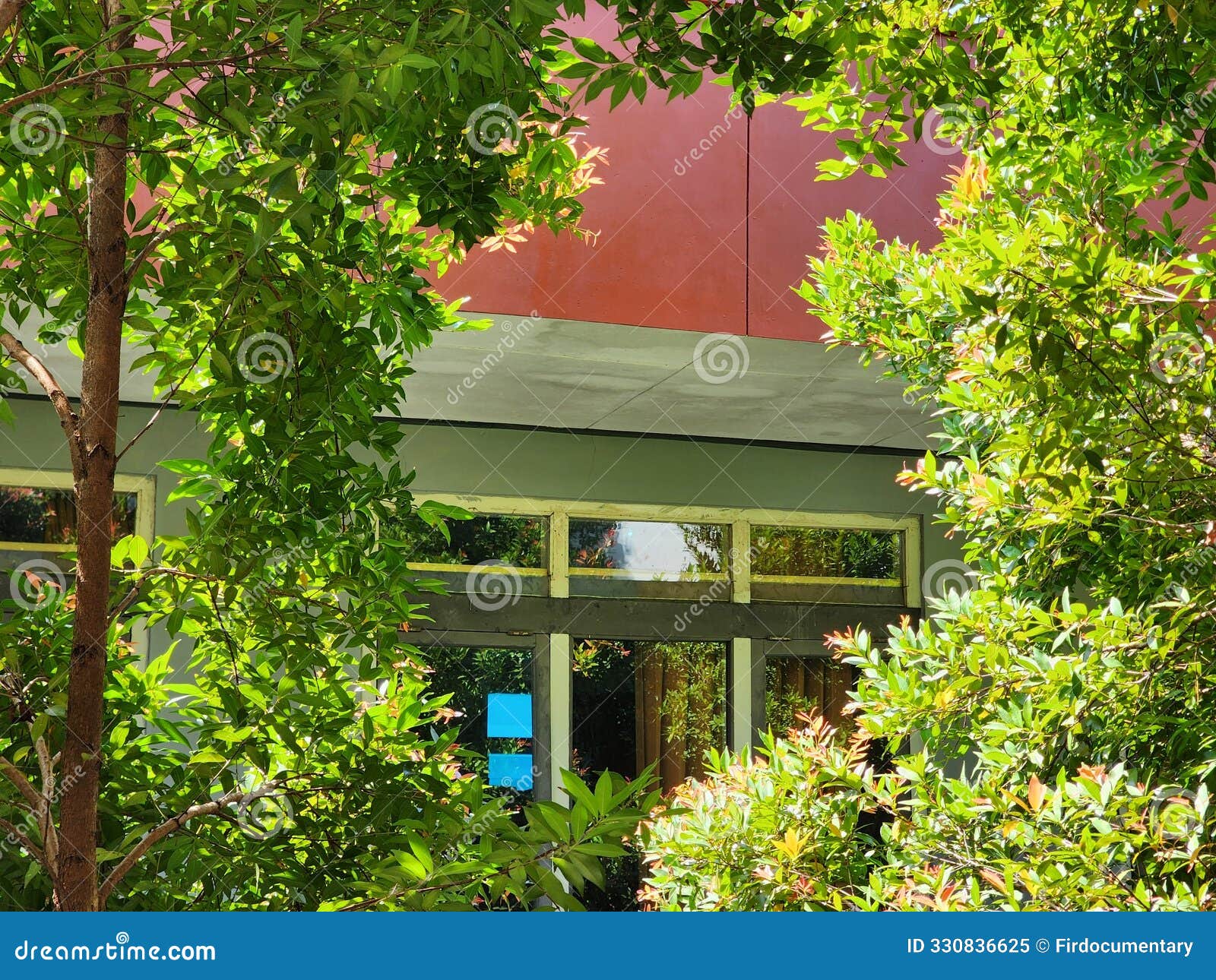 A Side of the Building Visible from between the Shady Trees Stock Image ...