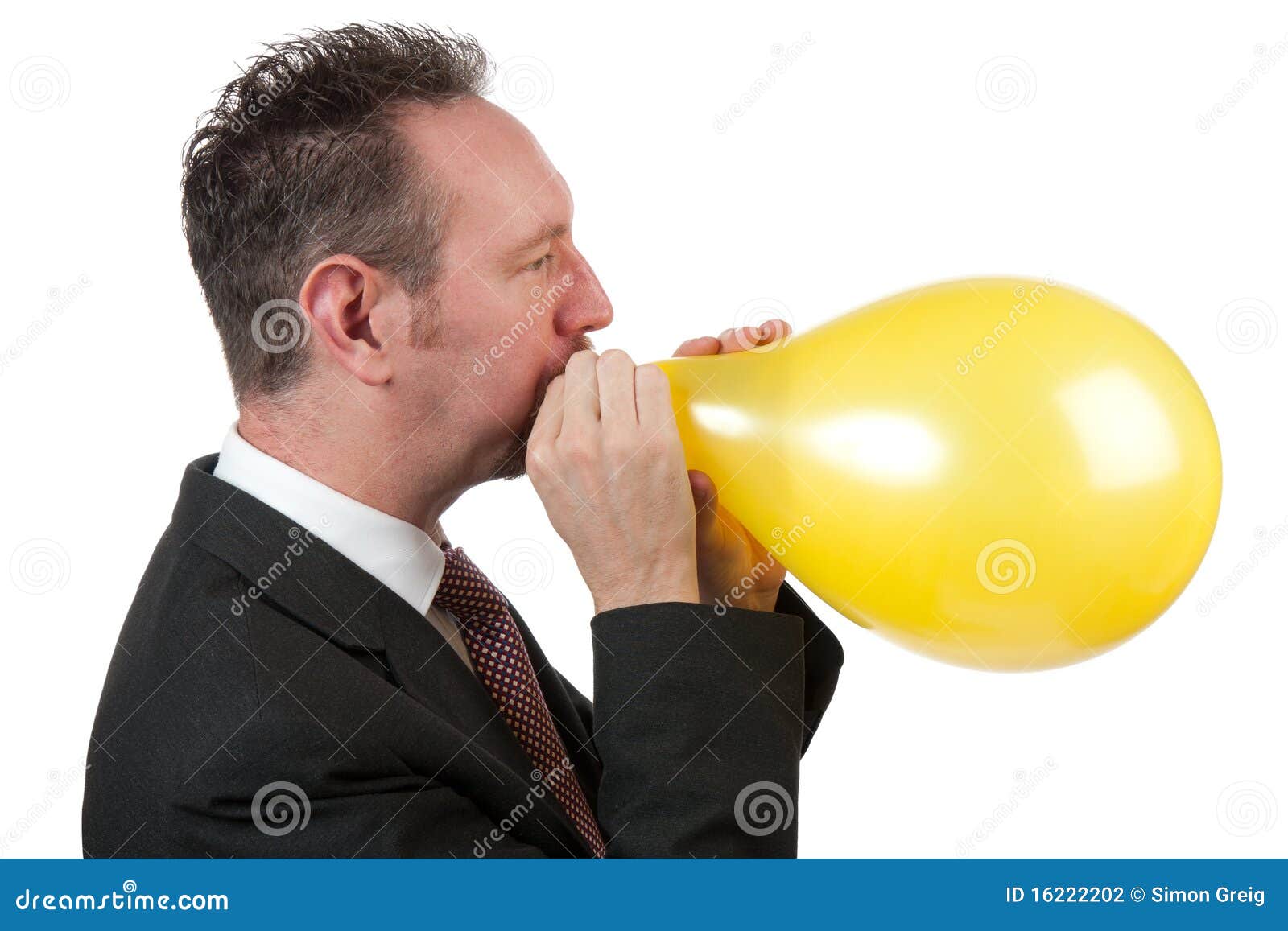 Side on Businessman Blowing Up a Balloon Stock Photo - Image of suit ...