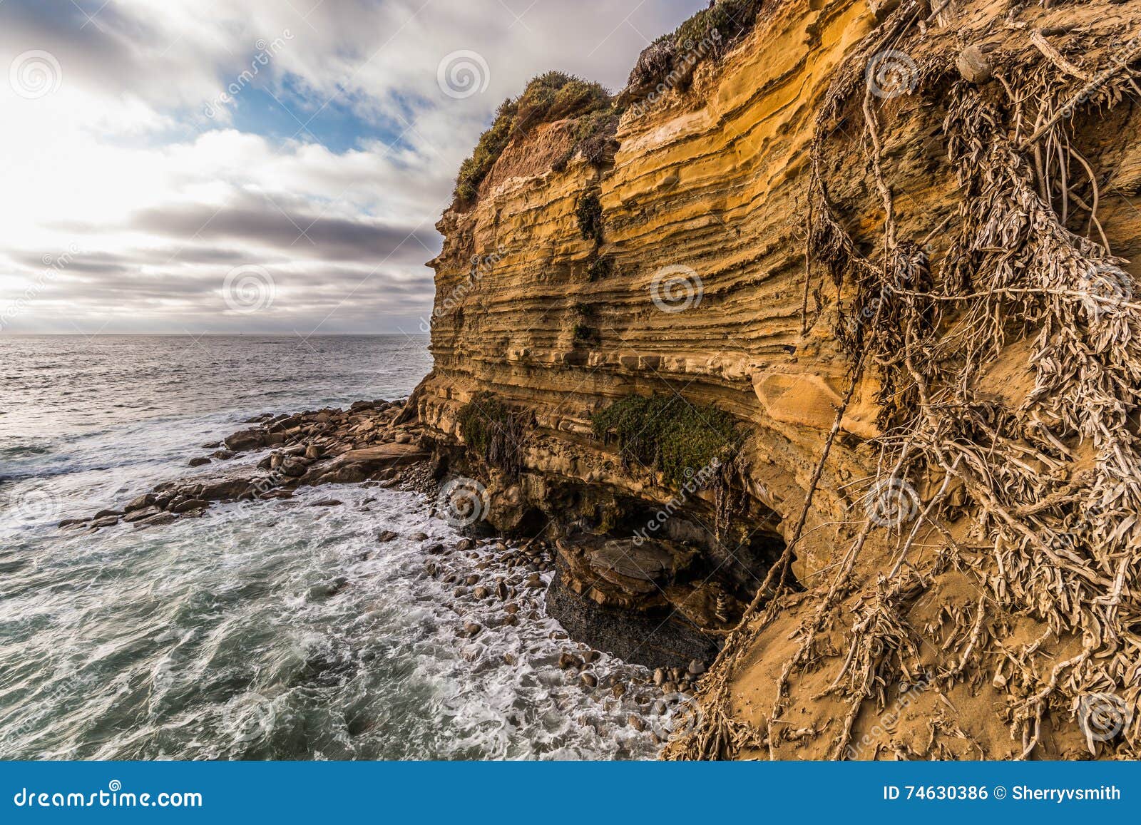 Side of Cliff with Ocean and Cloudy Sky, Sunset Cliffs Stock Photo ...