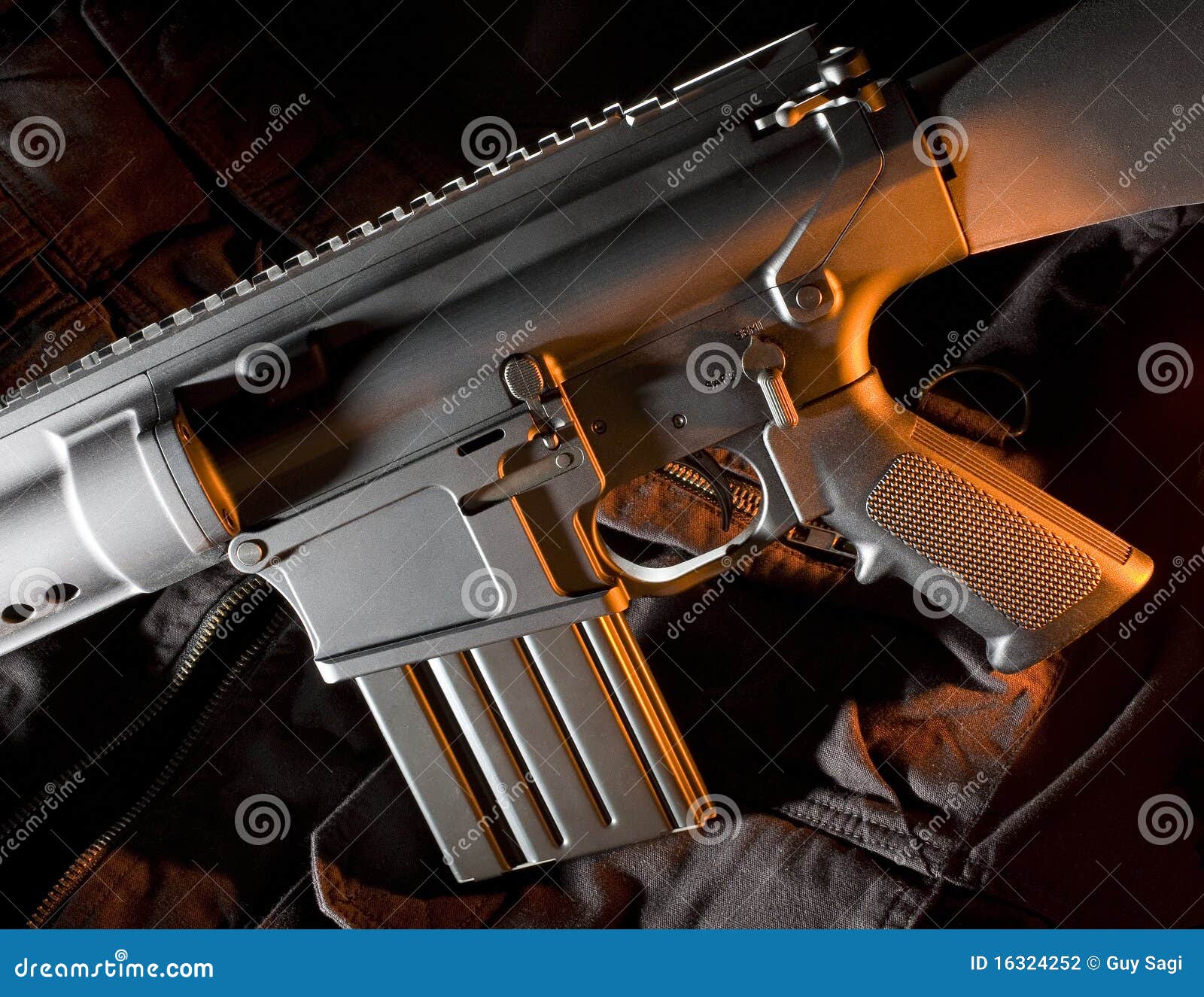 Side Lit Assault Rifle with Orange Stock Photo - Image of trigger ...