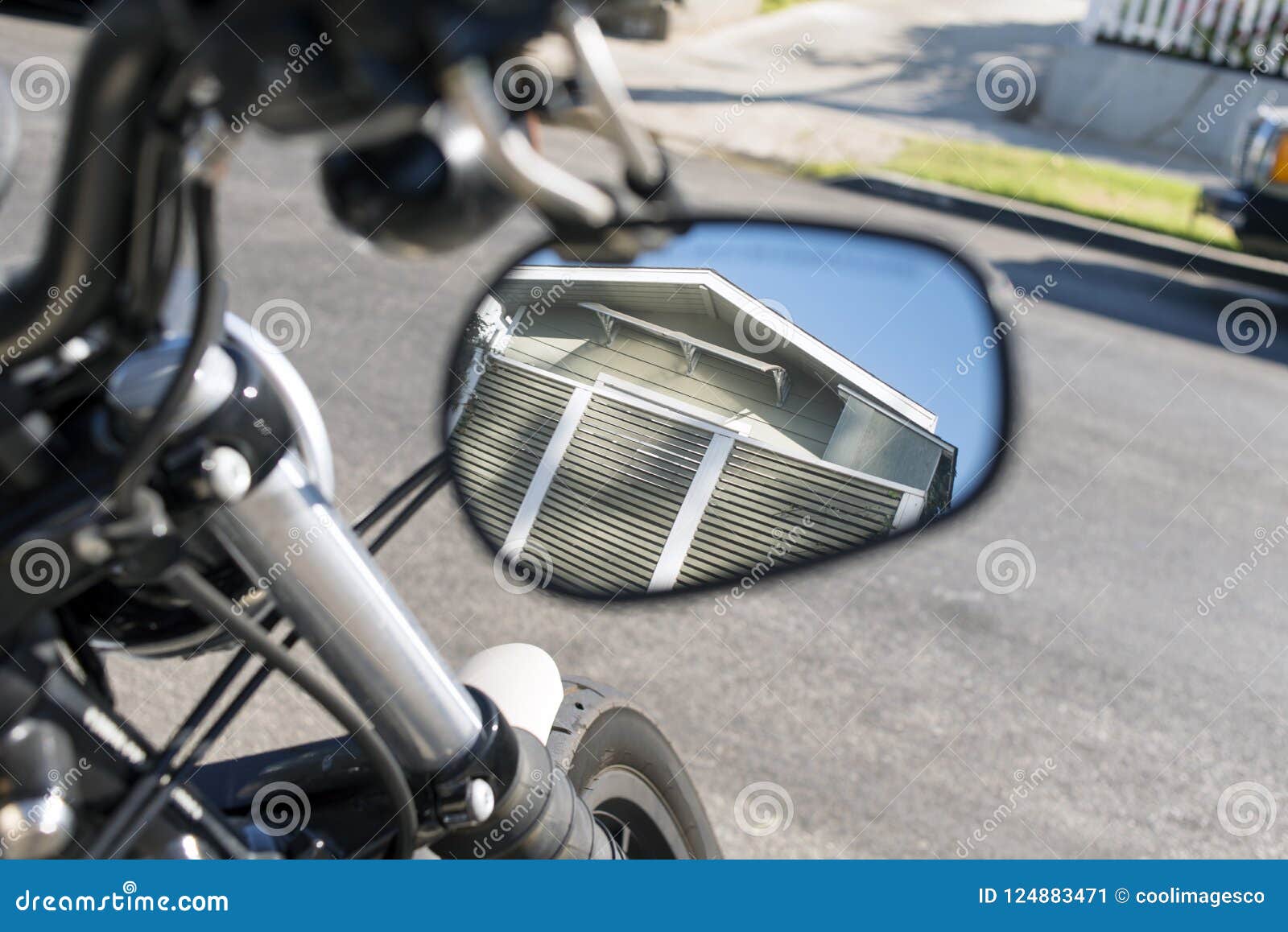 Side Mirror of a Motorcycle and a Reflection of a House in the Mirror ...
