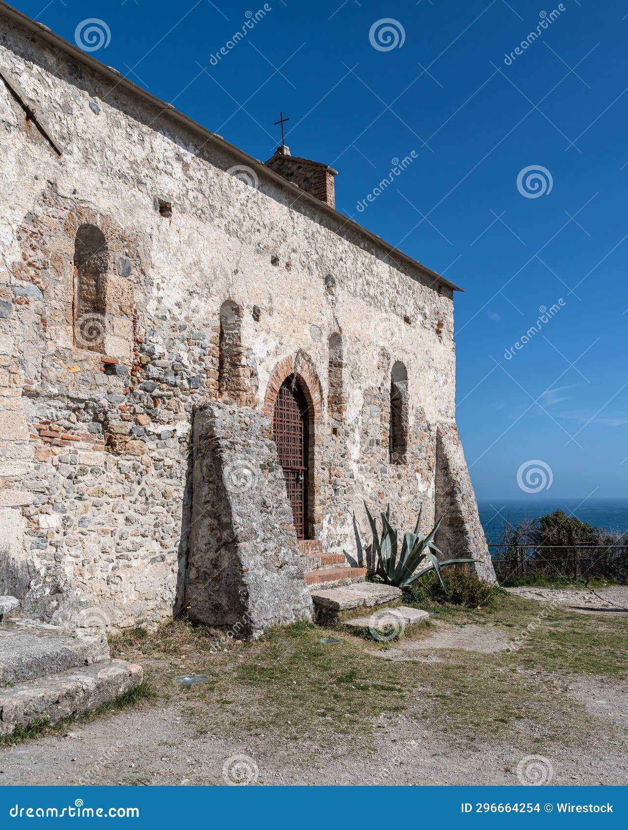 The Side of an Old Brick Building, with Windows and Doorways Stock ...