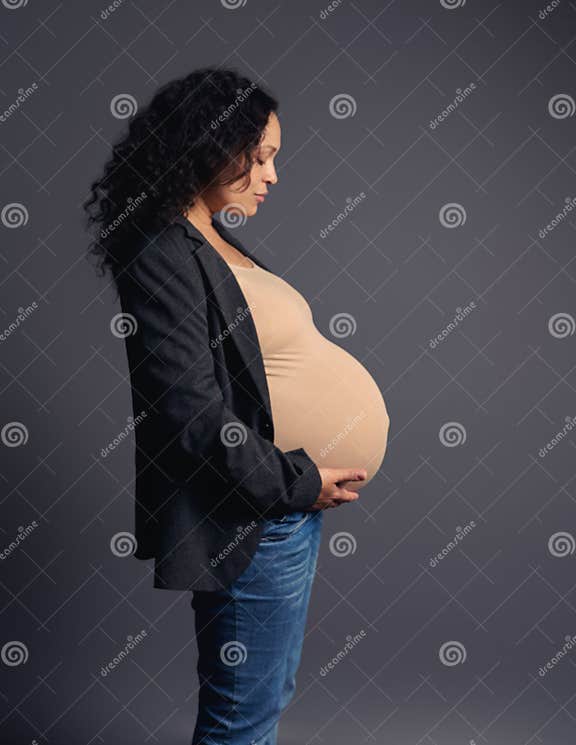 Beautiful Multi Ethnic Pregnant Woman Holding Her Belly In Pregnancy 36
