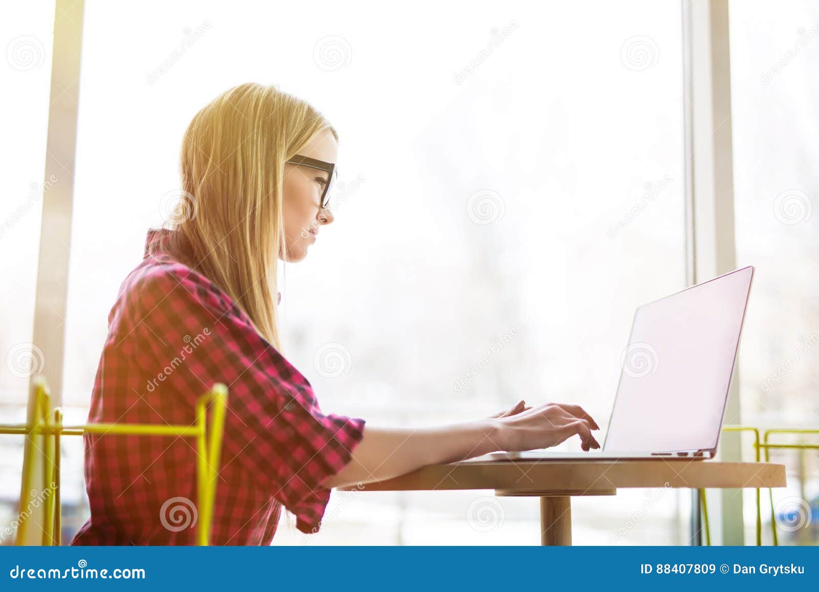 Side Portrait Young Woman Worker Sitting in Office while Using Laptop ...