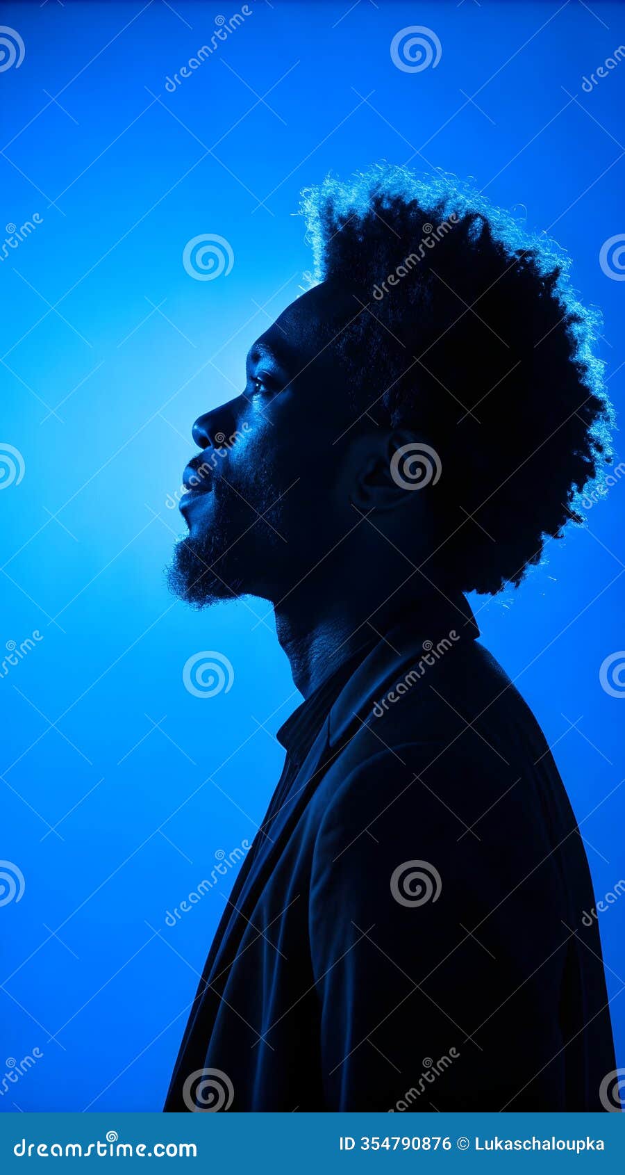 Side Profile of Black Man in Blue Light Creating Artistic Silhouette ...