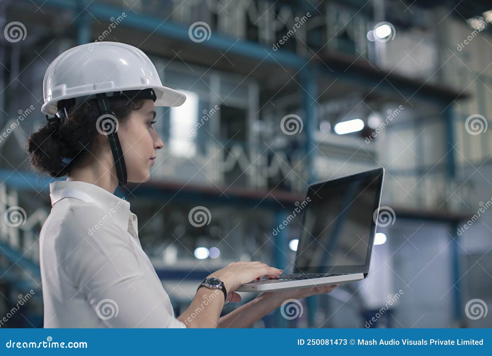 Side Profile of a Female Technical Engineer Working on a Laptop in the ...