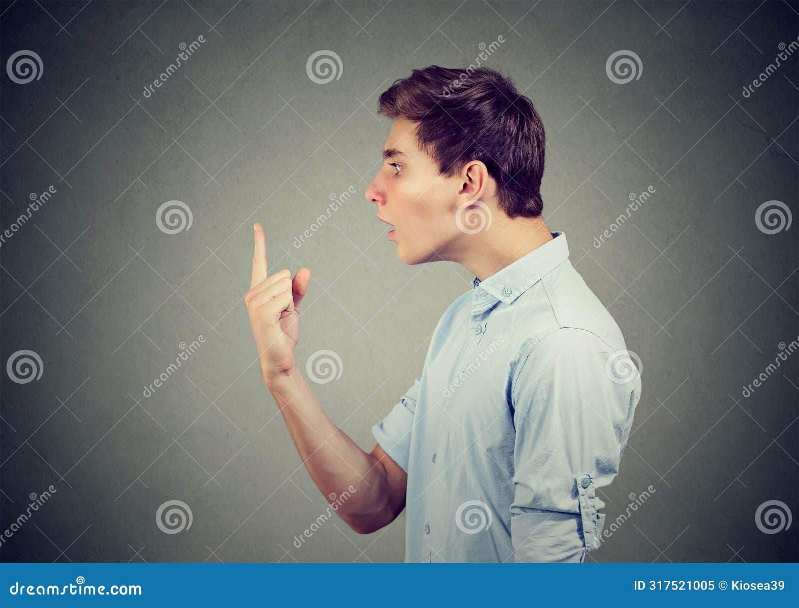 Side Profile of a Shocked Man Looking at His Finger Stock Image - Image ...