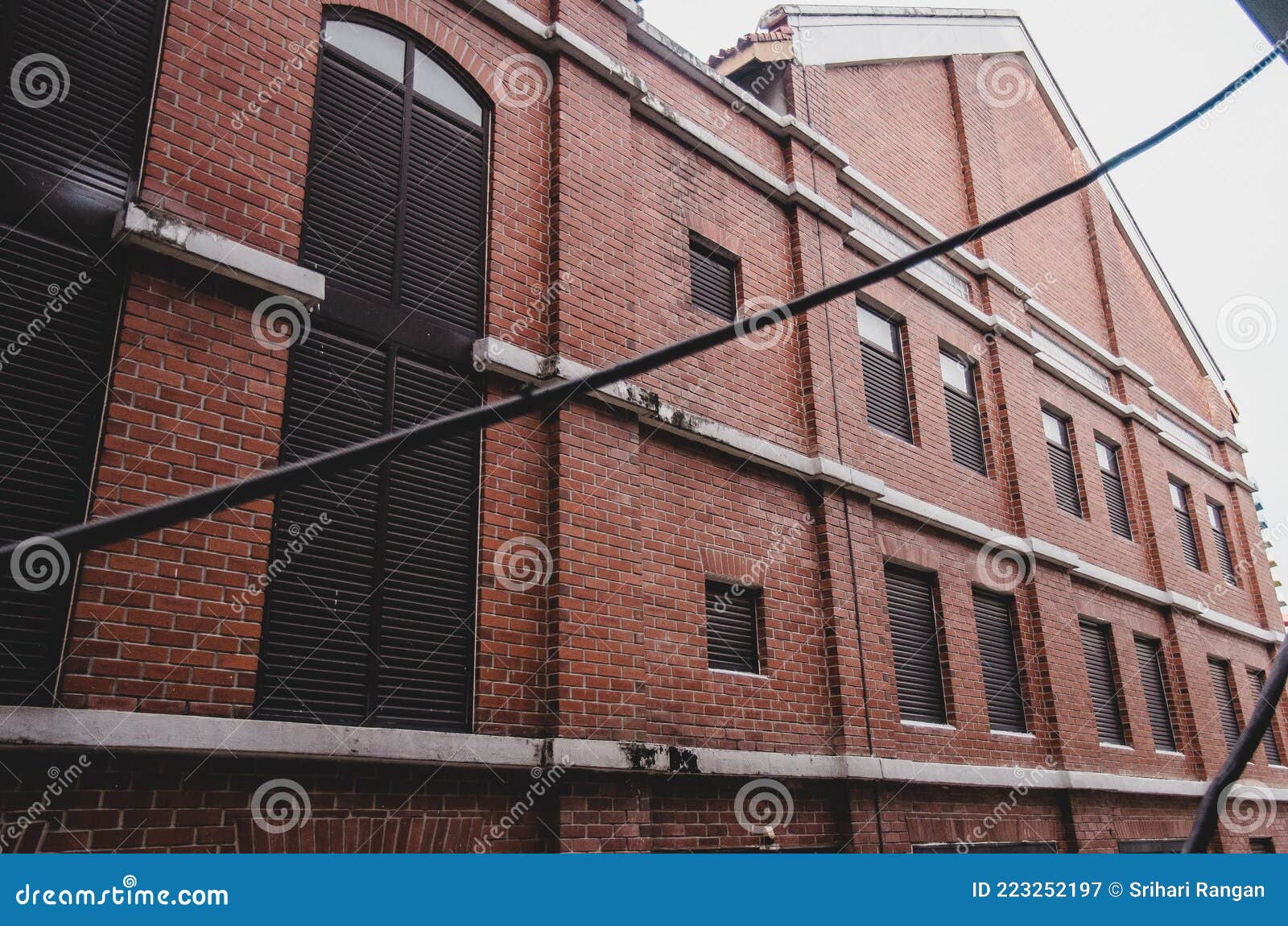 The Side of a Red Bricked Building Stock Image - Image of houses ...