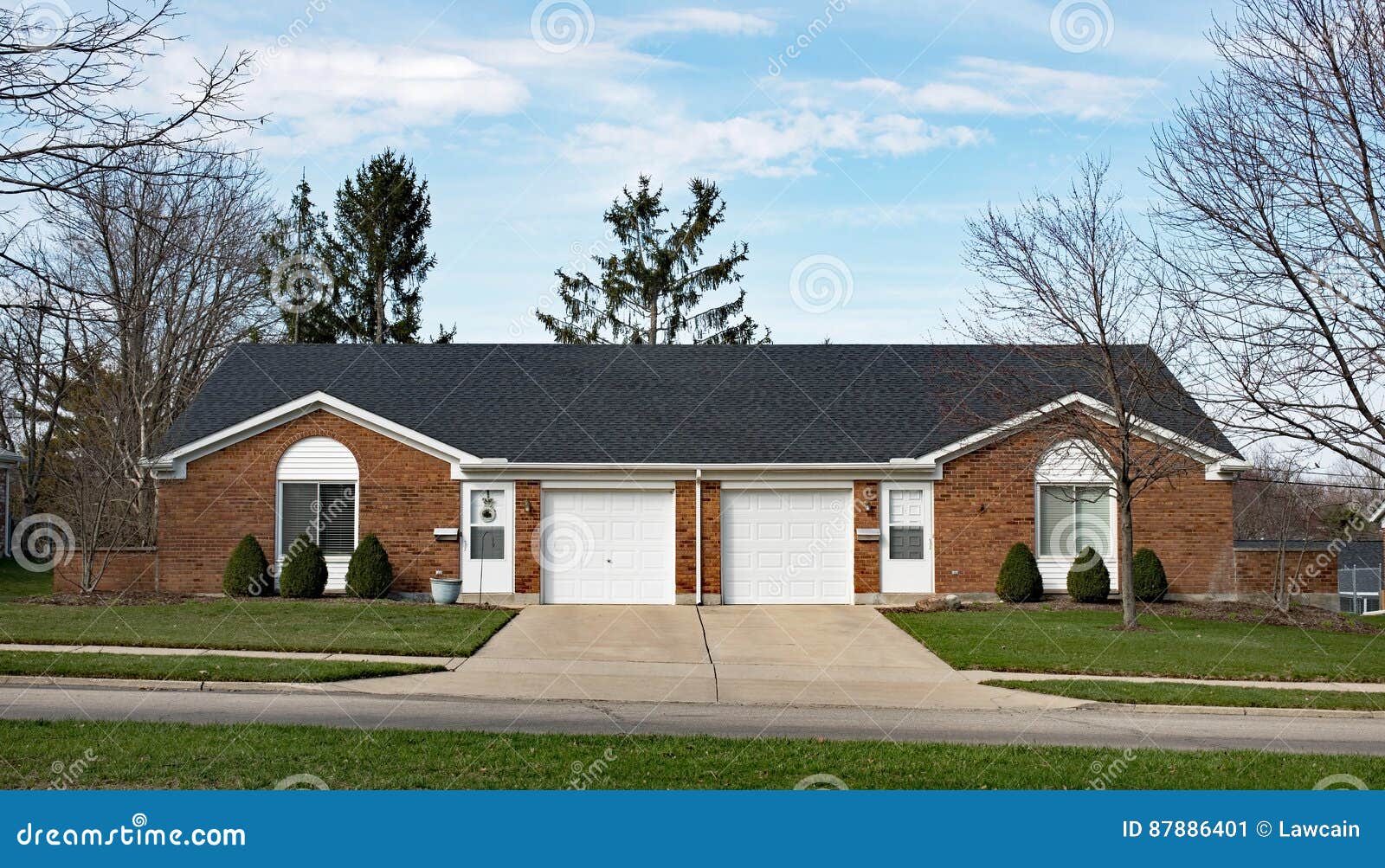 Side-by-side Red Brick Condos Stock Image - Image of arch, garage: 87886401