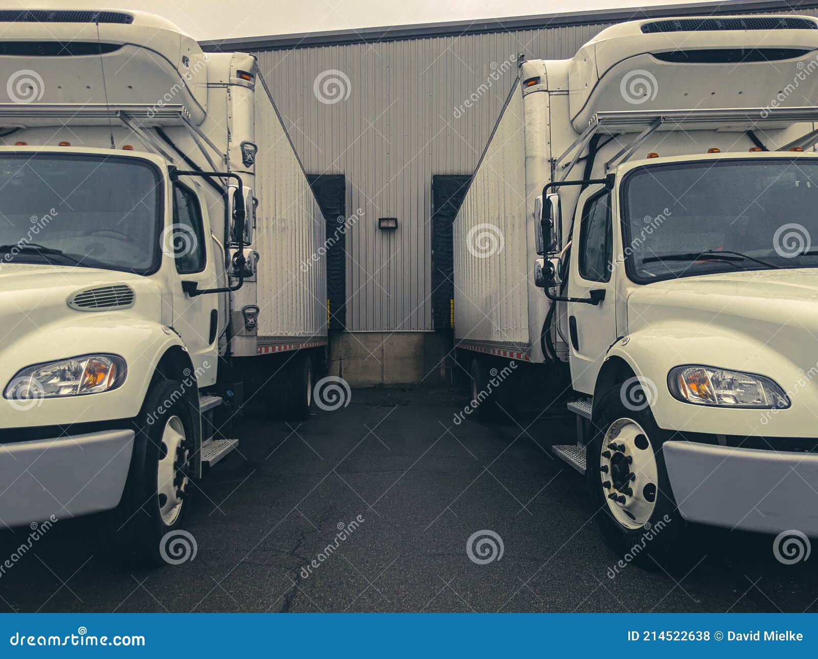 White Box Trucks Parked in the Loading Bay Stock Photo - Image of ...