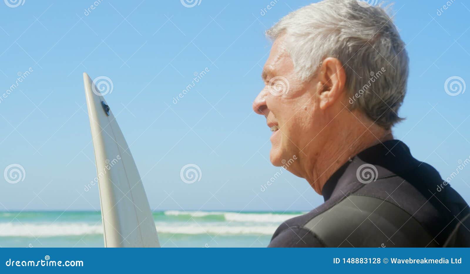 Side View of Active Senior Caucasian Man Standing with Surfboard on the ...