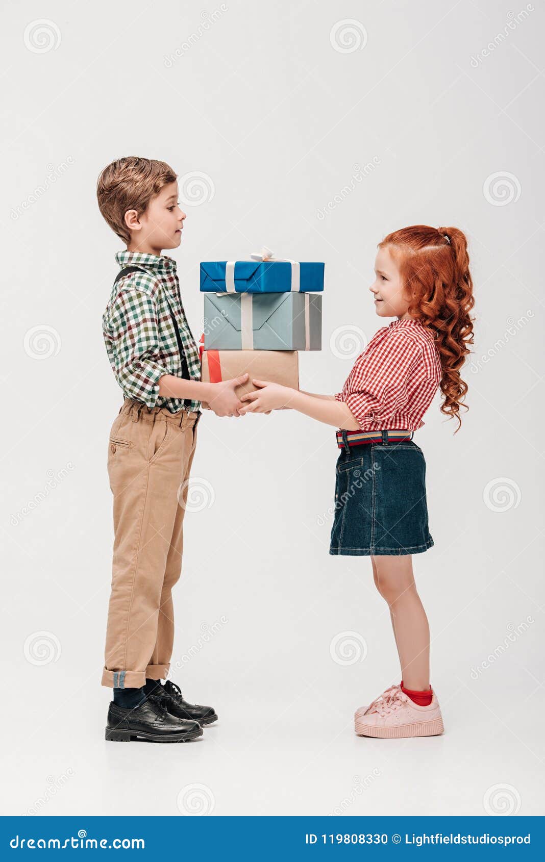Side View of Adorable Happy Kids Holding Presents Stock Photo - Image ...