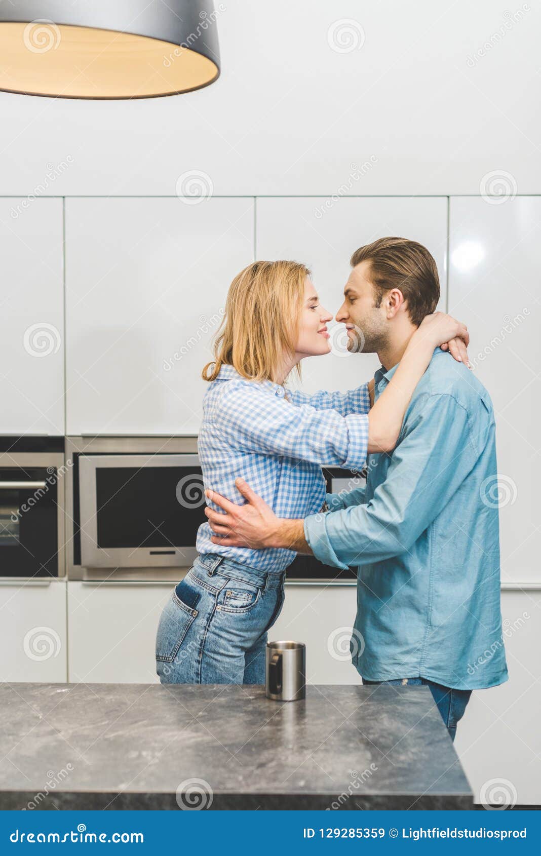Side View of Affectionate Couple Hugging Each Other Stock Image - Image ...